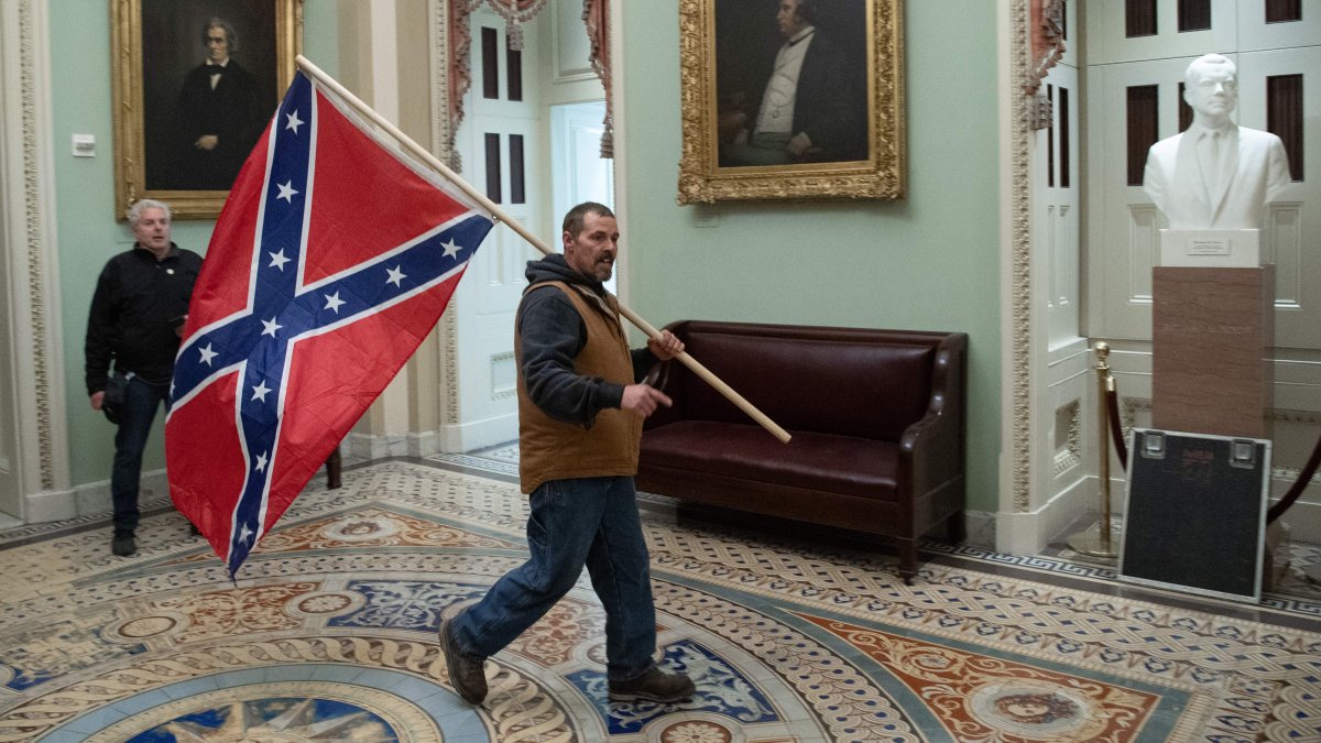 Man Photographed With Confederate Flag During Capitol Riot Arrested ...