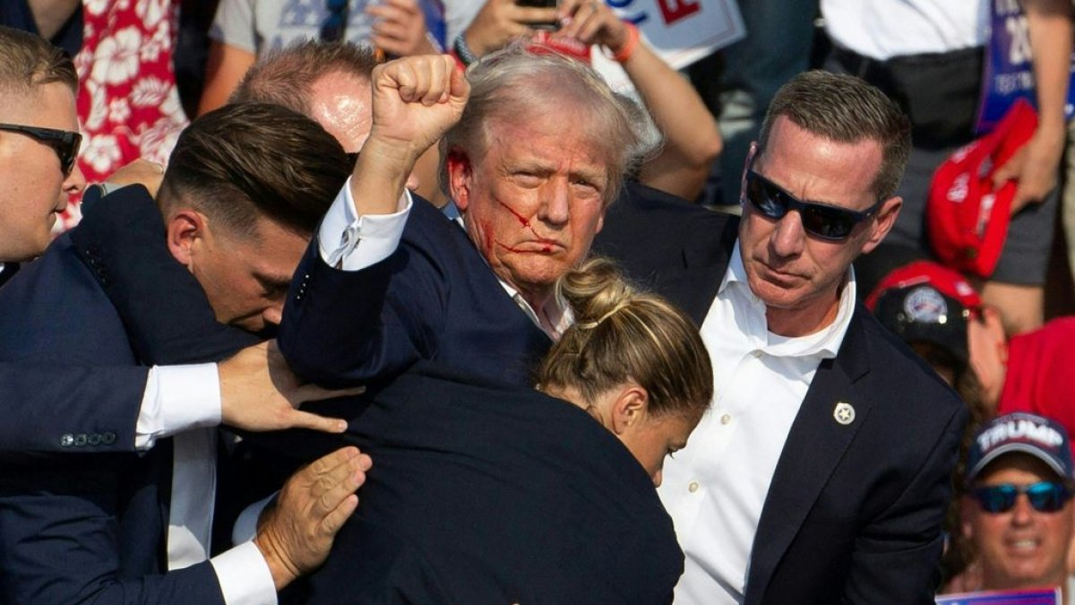 Trump injured, rushed from stage after shooter fired on his ...