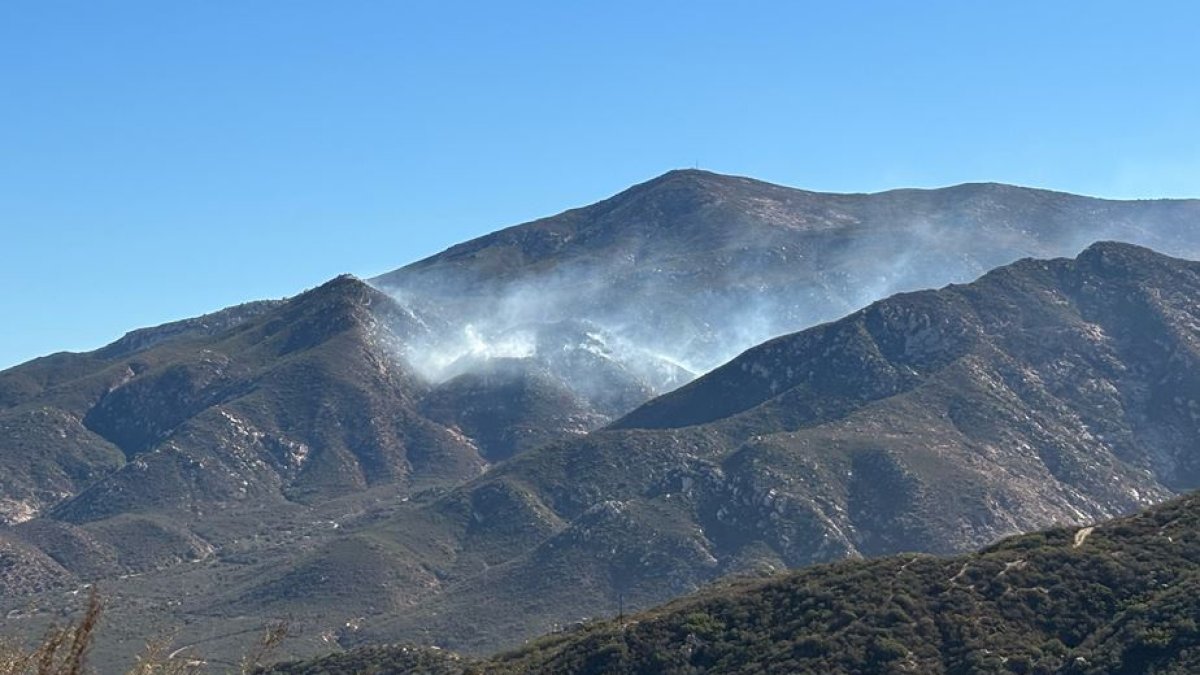 Evacuation order lifted after East County brush fire burns near US ...