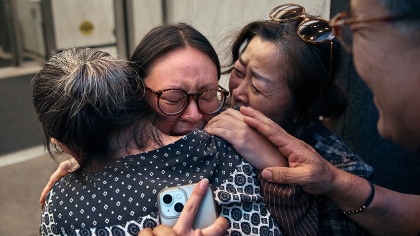 Yeonsoo Go reunites with her mother, Episcopal priest the Rev. Kyrie Kim (L) after being released by ICE on Aug. 4, 2025 in New York City.